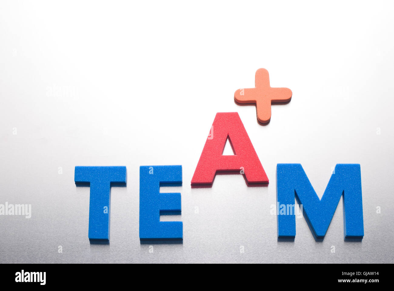 A plus Team word Stock Photo - Alamy