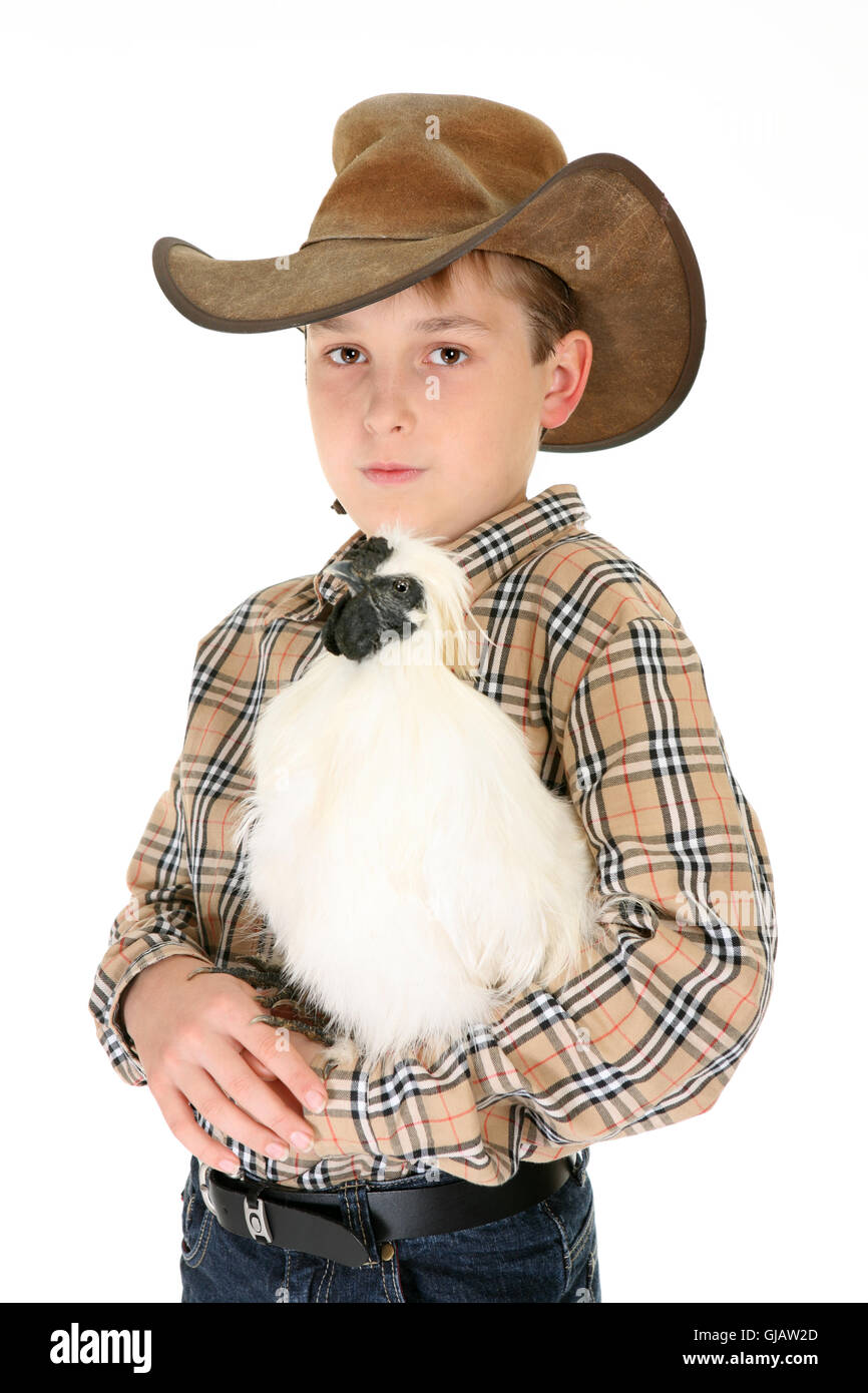 Country boy holding a chicken Stock Photo - Alamy