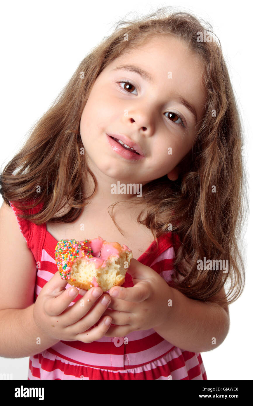 Smiling girl eating snack Stock Photo - Alamy