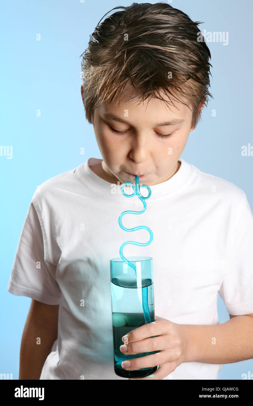 Child drinking through a straw Stock Photo - Alamy
