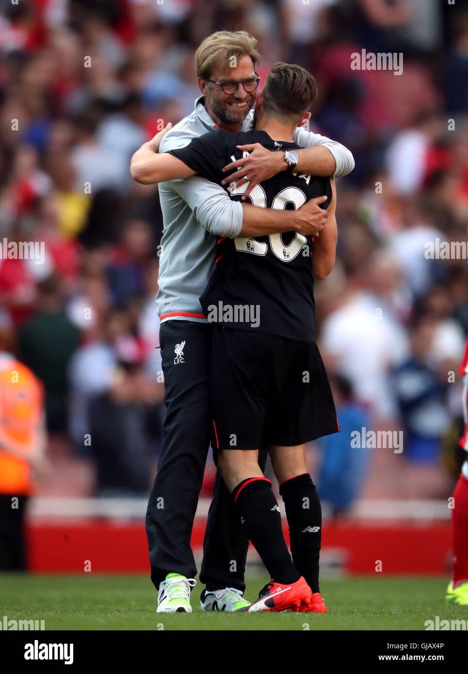 Liverpool manager Jurgen Klopp celebrates with Adam Lallana after the ...