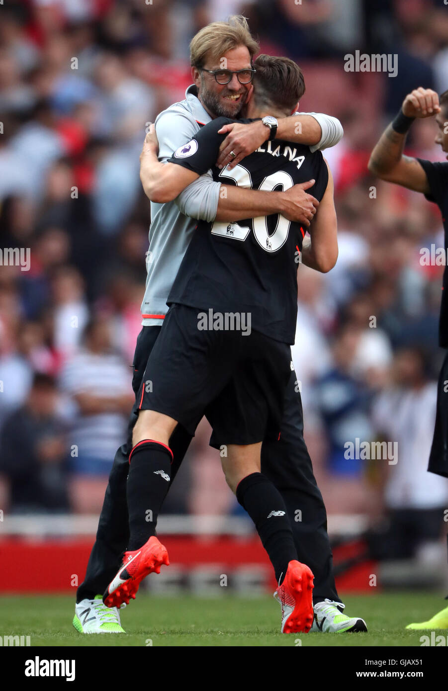 Liverpool manager Jurgen Klopp celebrates with Adam Lallana after the ...