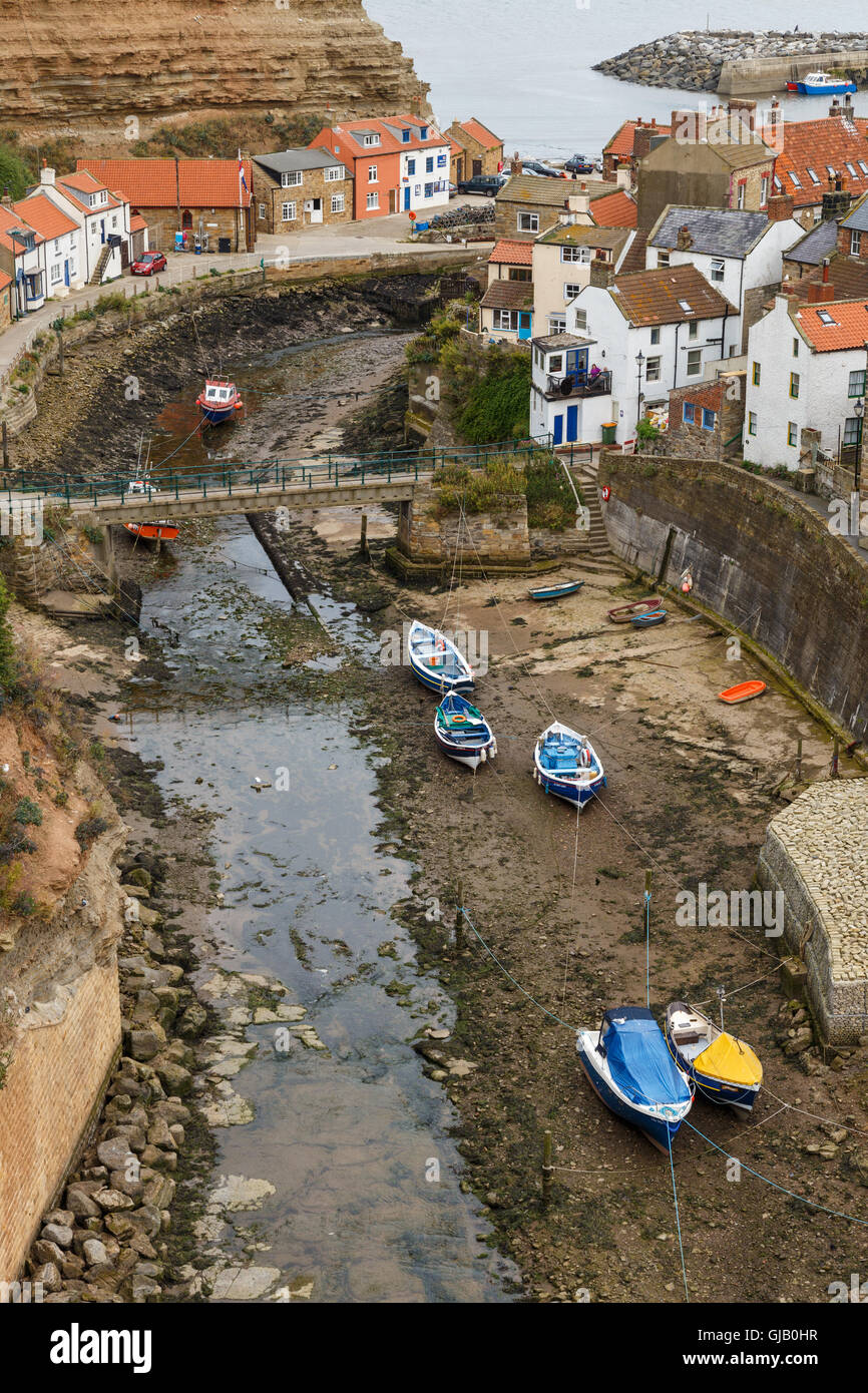 High view looking down onto Staithes Beck and the town. In Staithes ...