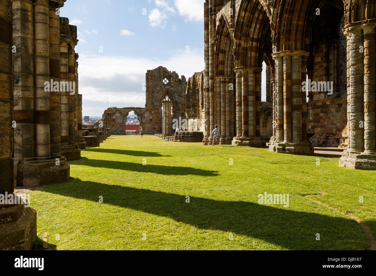 Tourists visiting the ruins of Whitby Abbey Stock Photo - Alamy