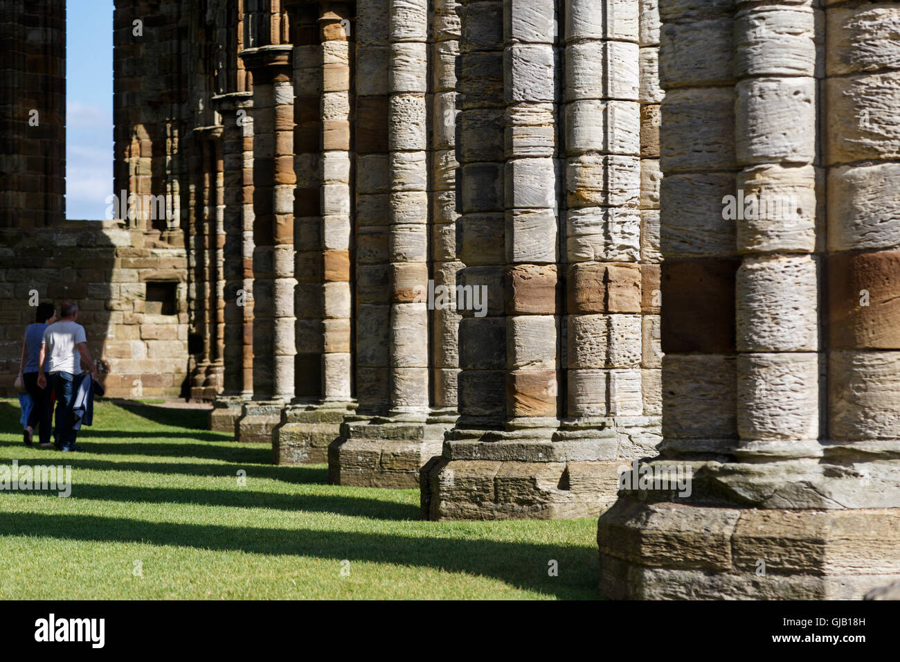 Tourists visiting the ruins of Whitby Abbey Stock Photo - Alamy