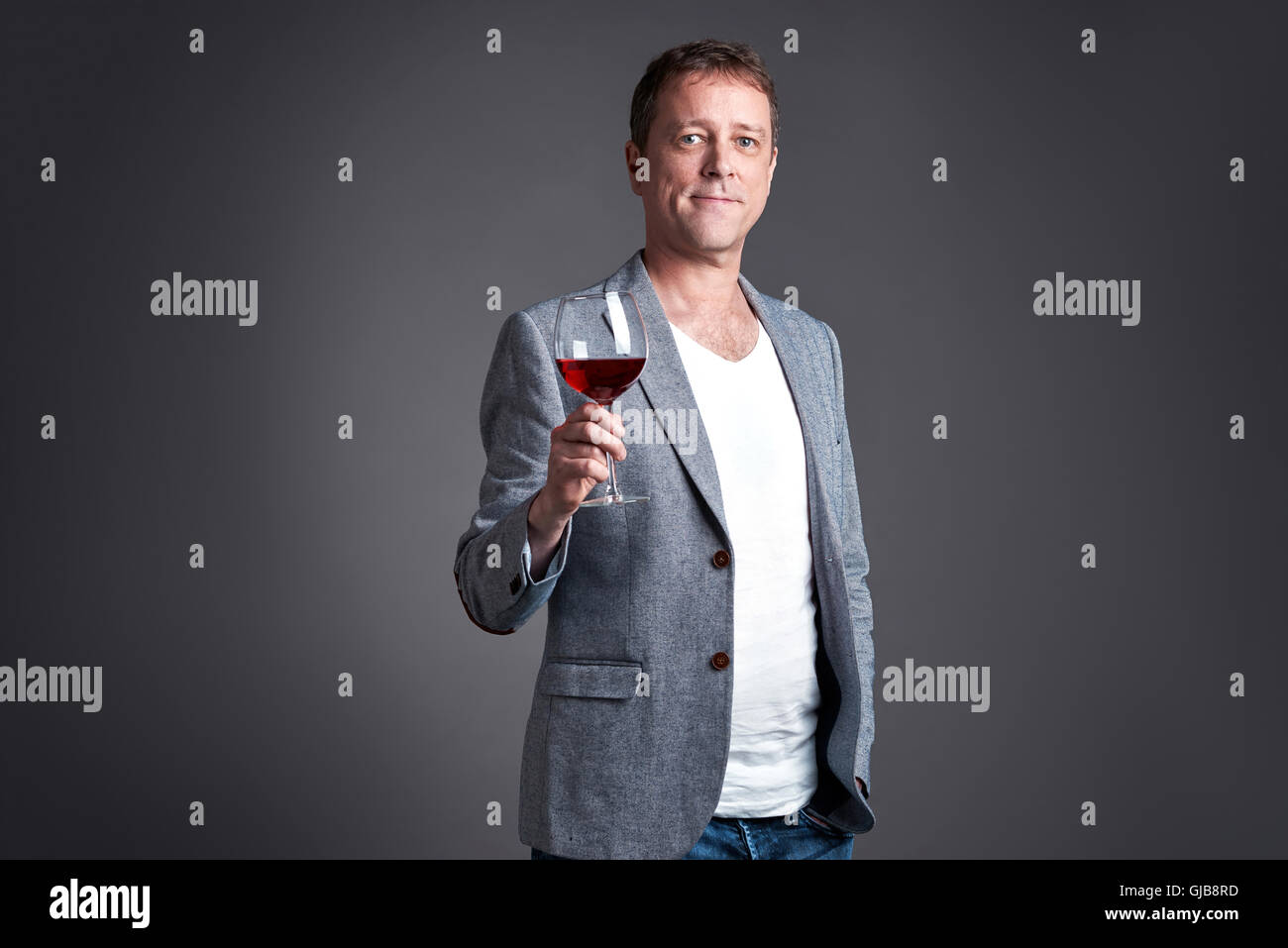 Raise a glass of red wine hi-res stock photography and images - Alamy