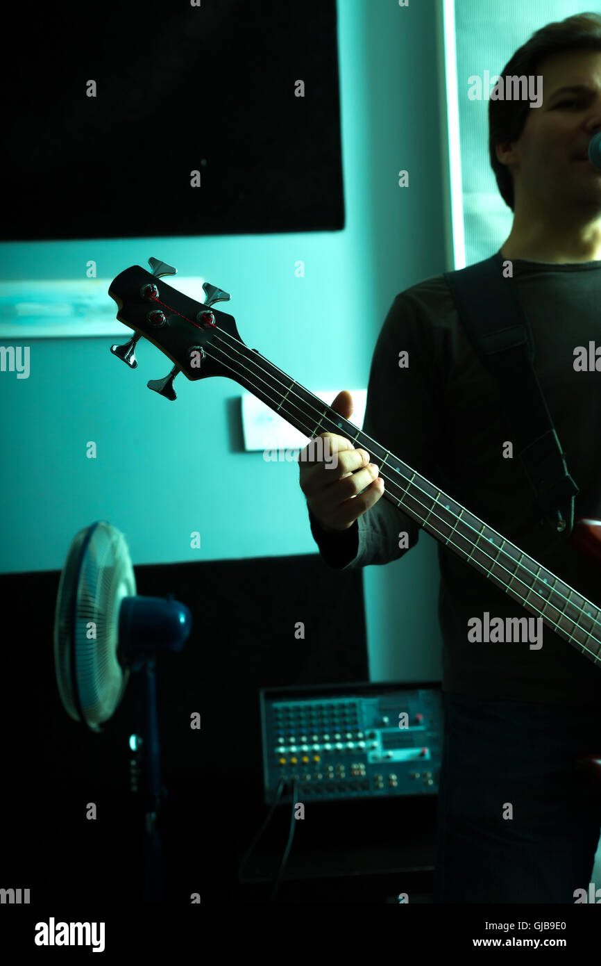 A Rock musician playing bass Stock Photo - Alamy