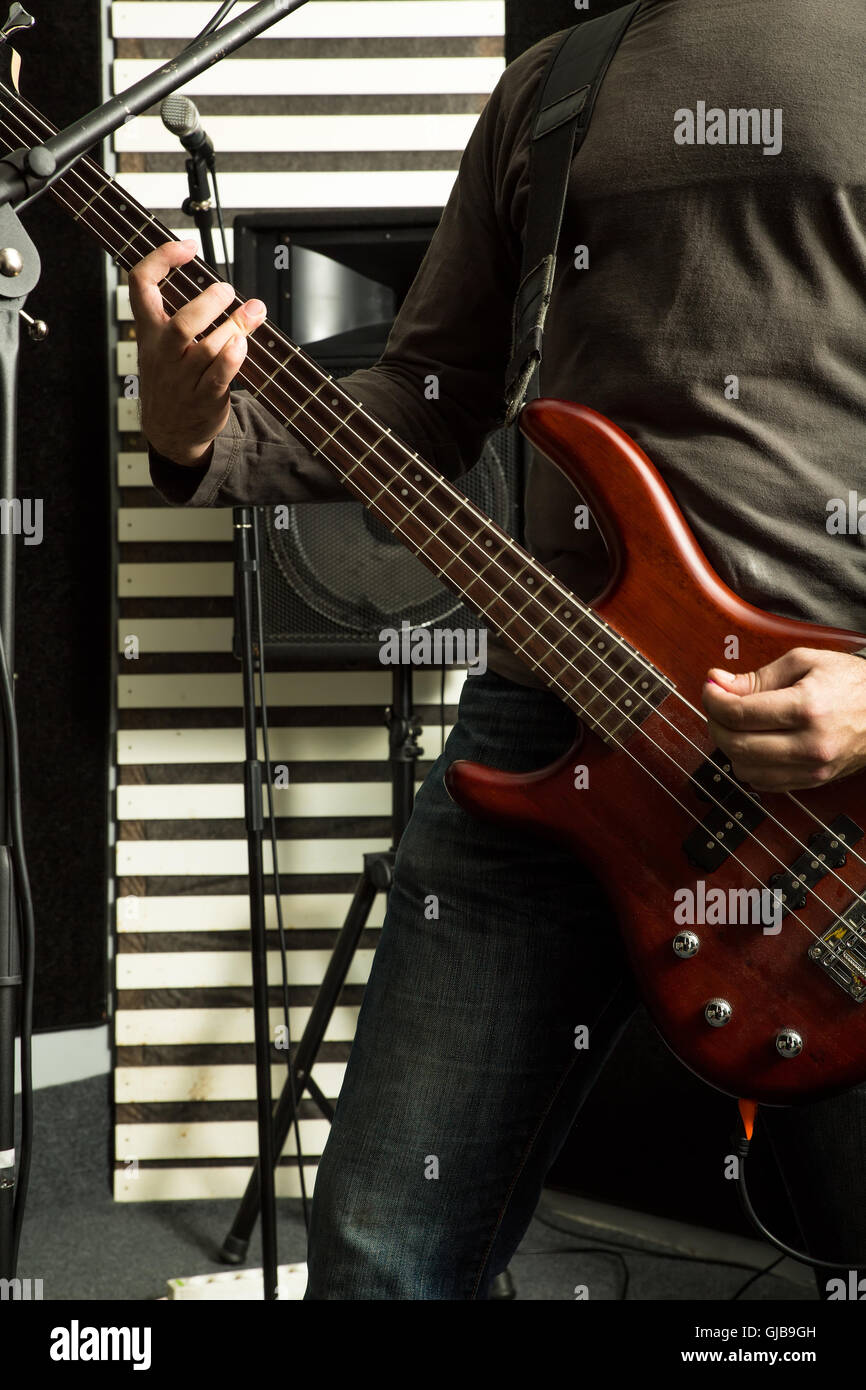 A Rock musician playing bass Stock Photo - Alamy