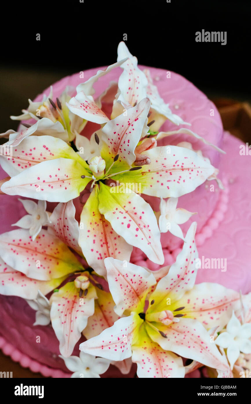 pink Wedding Cake with Lily Stock Photo - Alamy