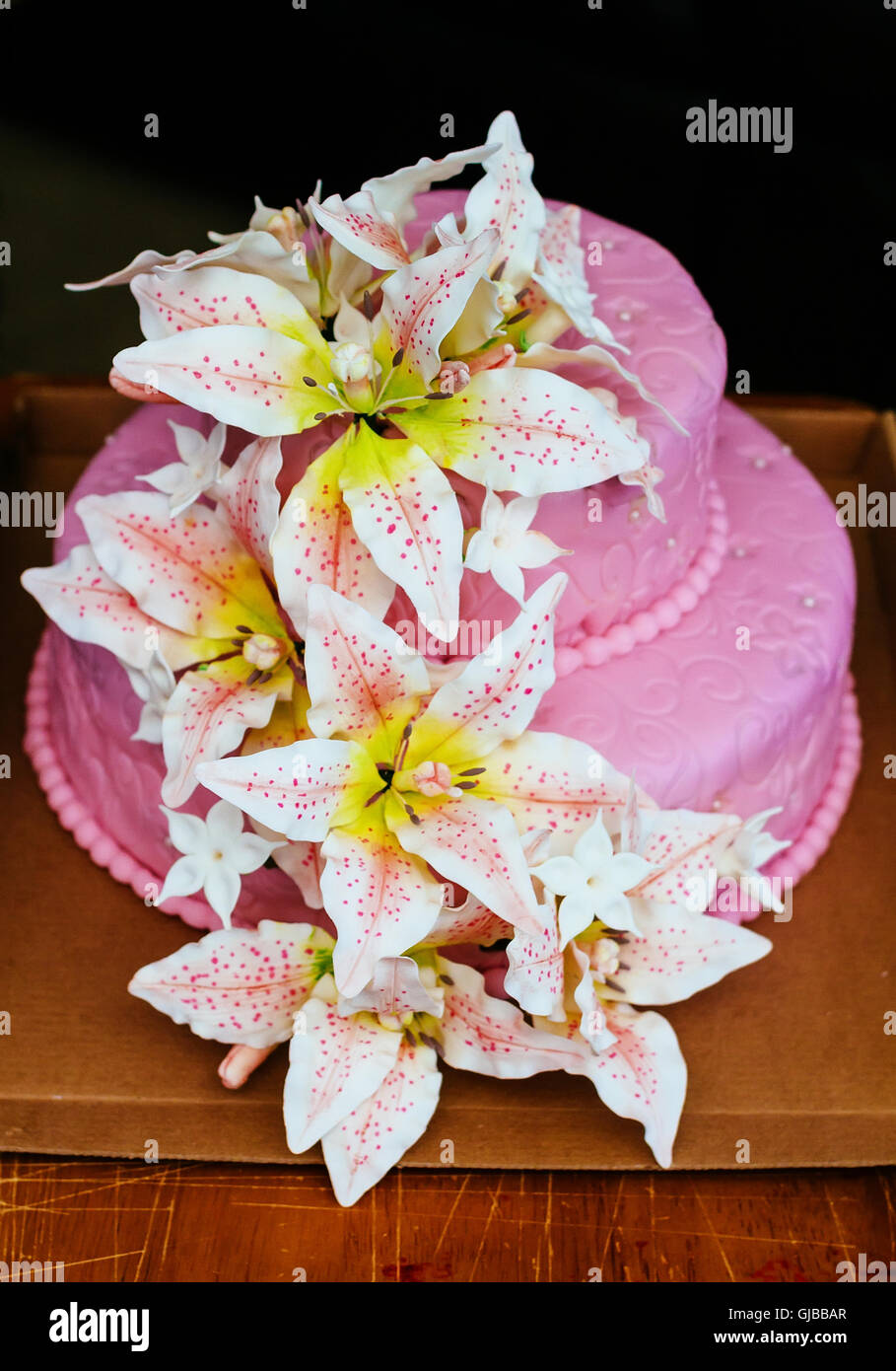 pink Wedding Cake with Lily Stock Photo - Alamy