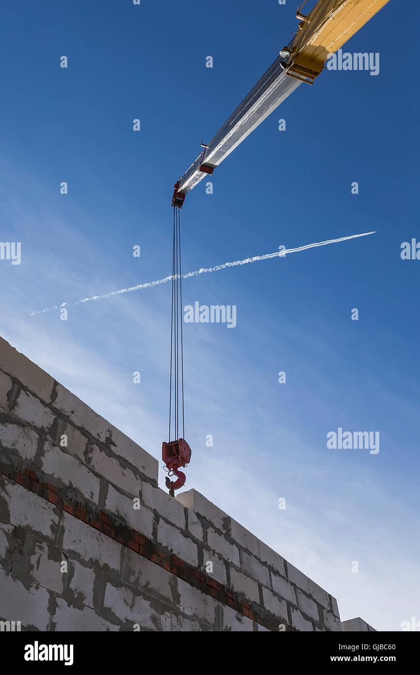 Crane arm with large hook on a construction site Stock Photo - Alamy