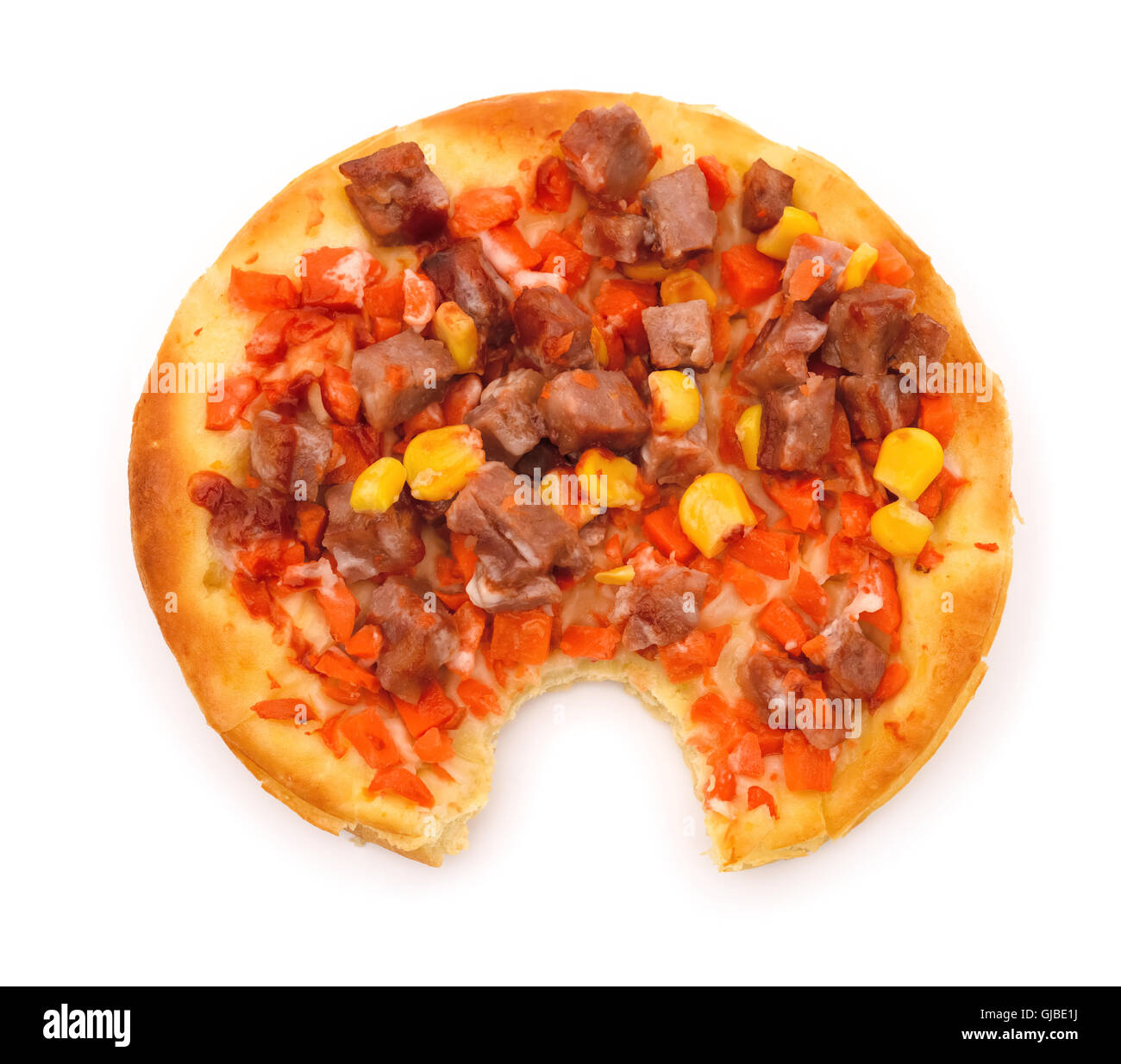 top view pizza with meat maize and carrot with a bite on white ...