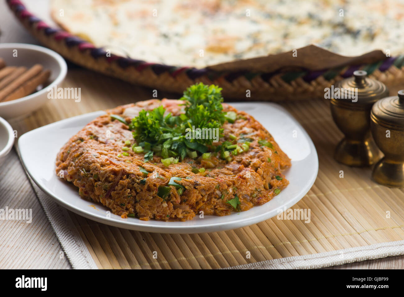 oqda , fried potatoes with meat popular arab food Stock Photo - Alamy