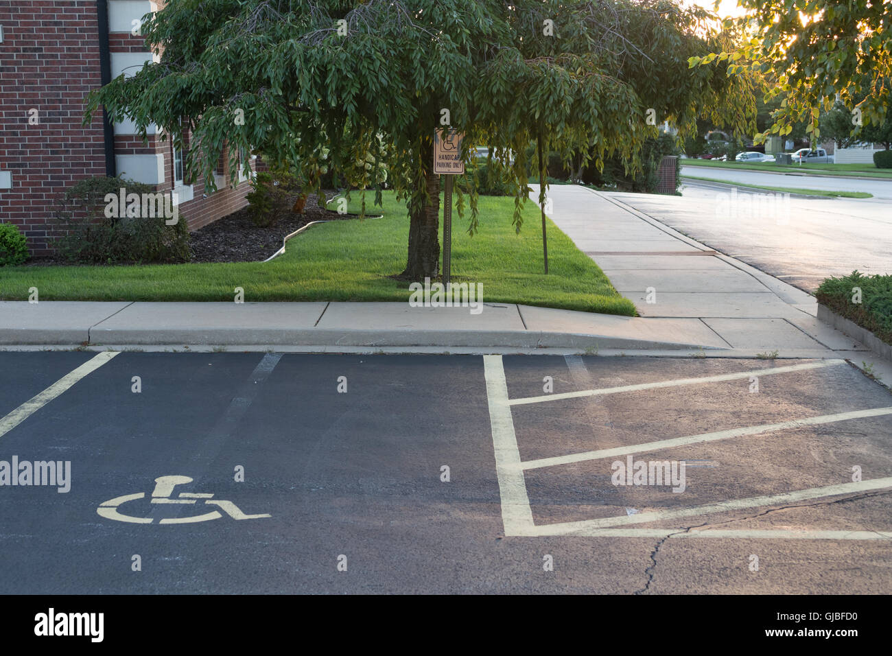 Handicap parking spaces and sign Stock Photo - Alamy