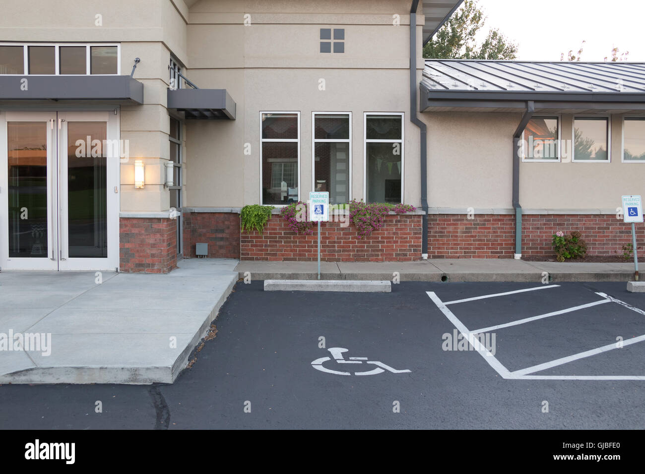 Handicap parking spaces and sign Stock Photo - Alamy
