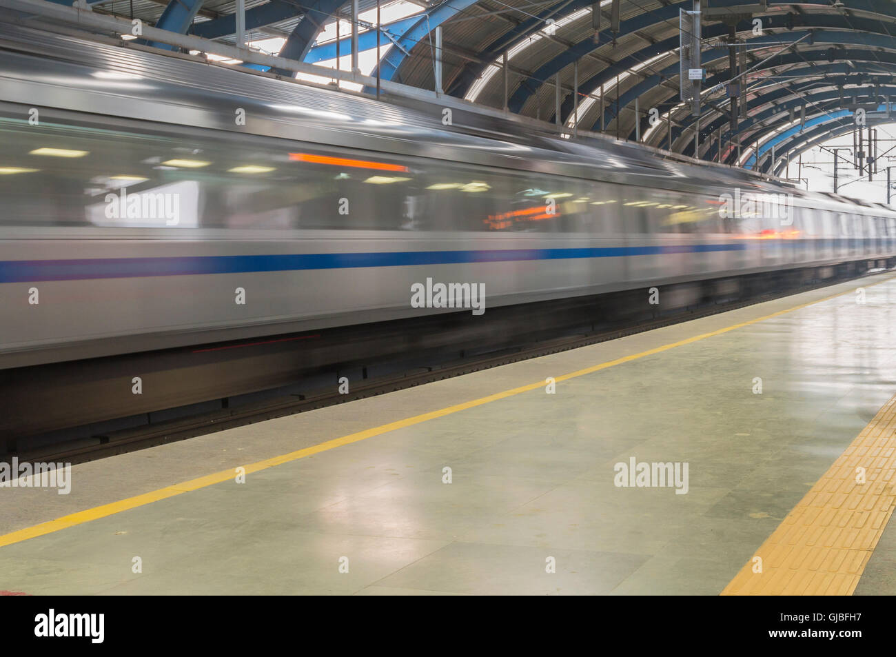 Moving Train from Station Stock Photo - Alamy