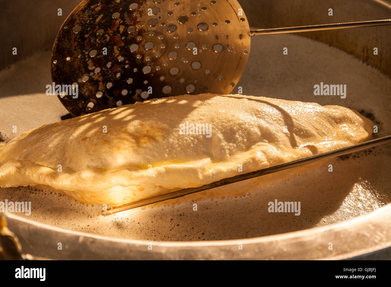 Pizza, the making of... the fried calzone Stock Photo - Alamy