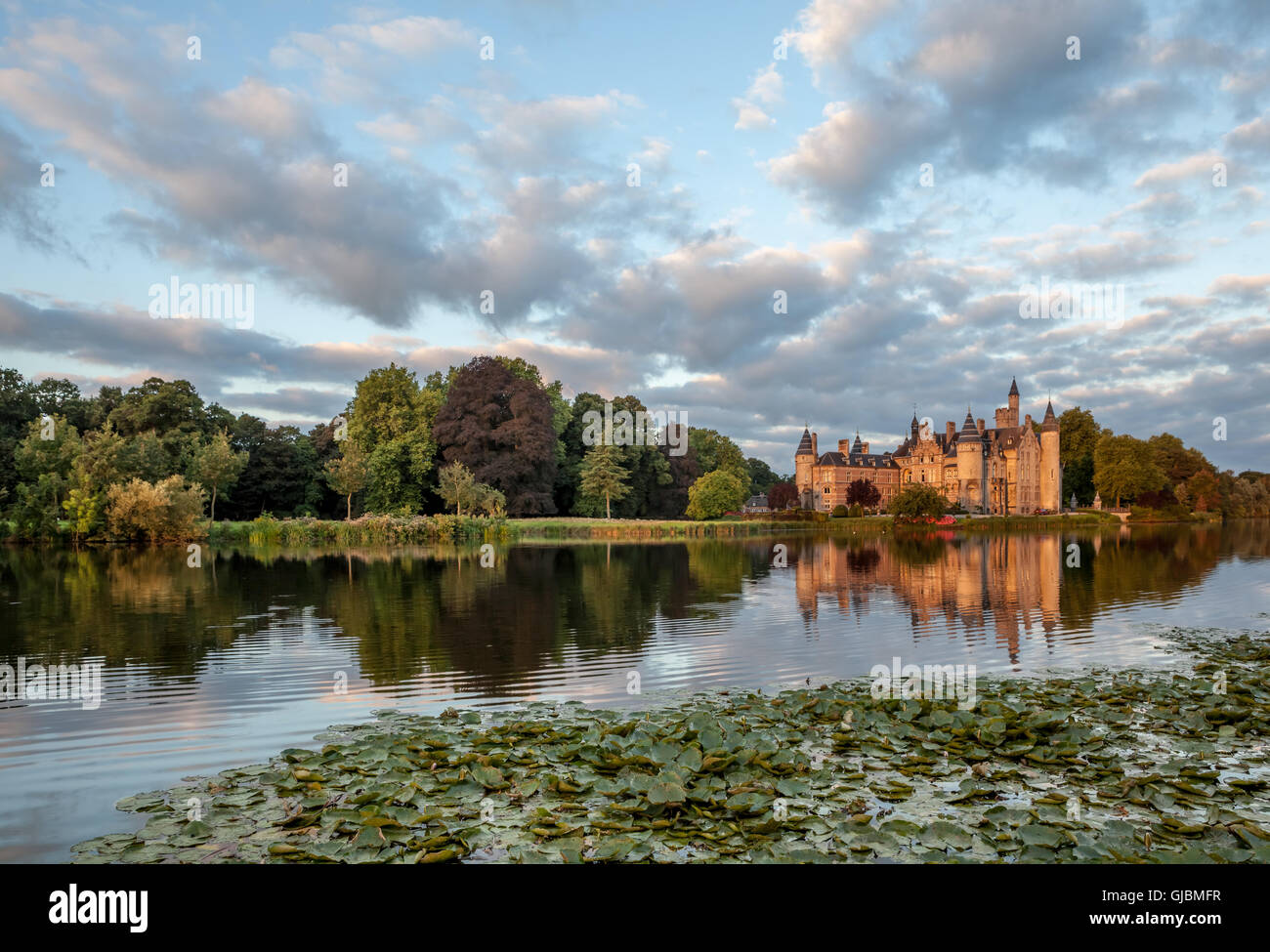 in the twilight on the river near an castle Stock Photo - Alamy