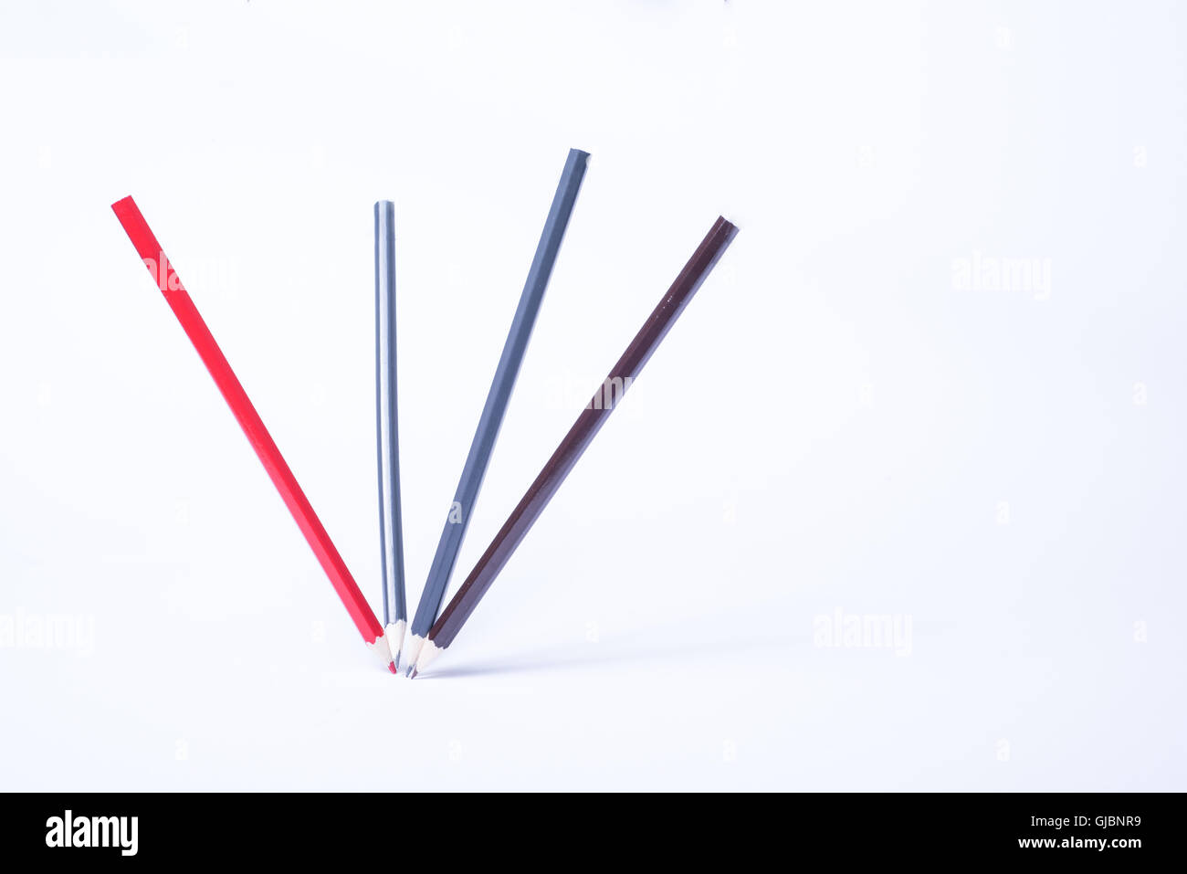 four dancing pencils as still life on white background Stock Photo - Alamy
