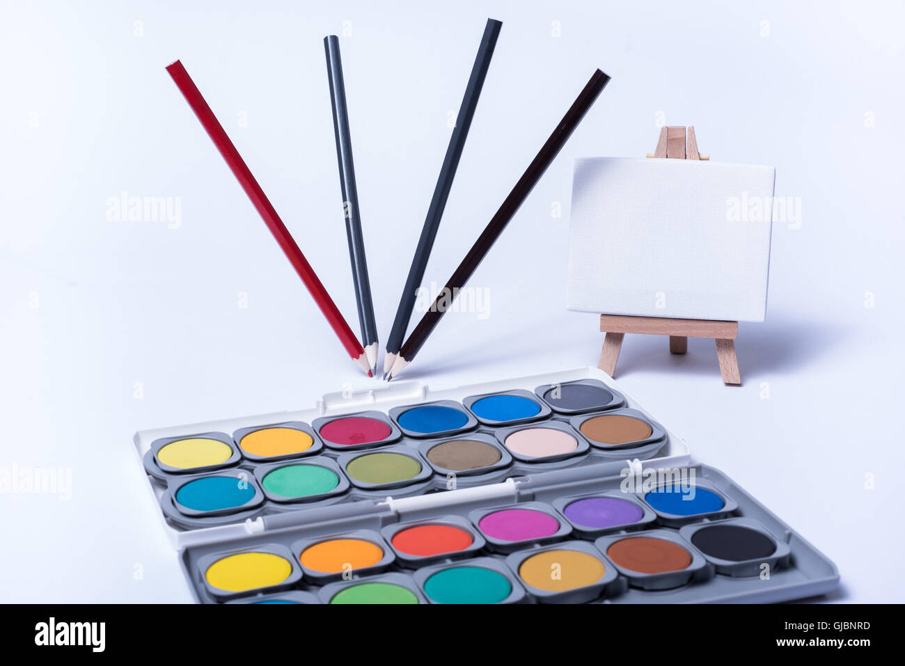 four dancing pencils as still life on white background Stock Photo - Alamy
