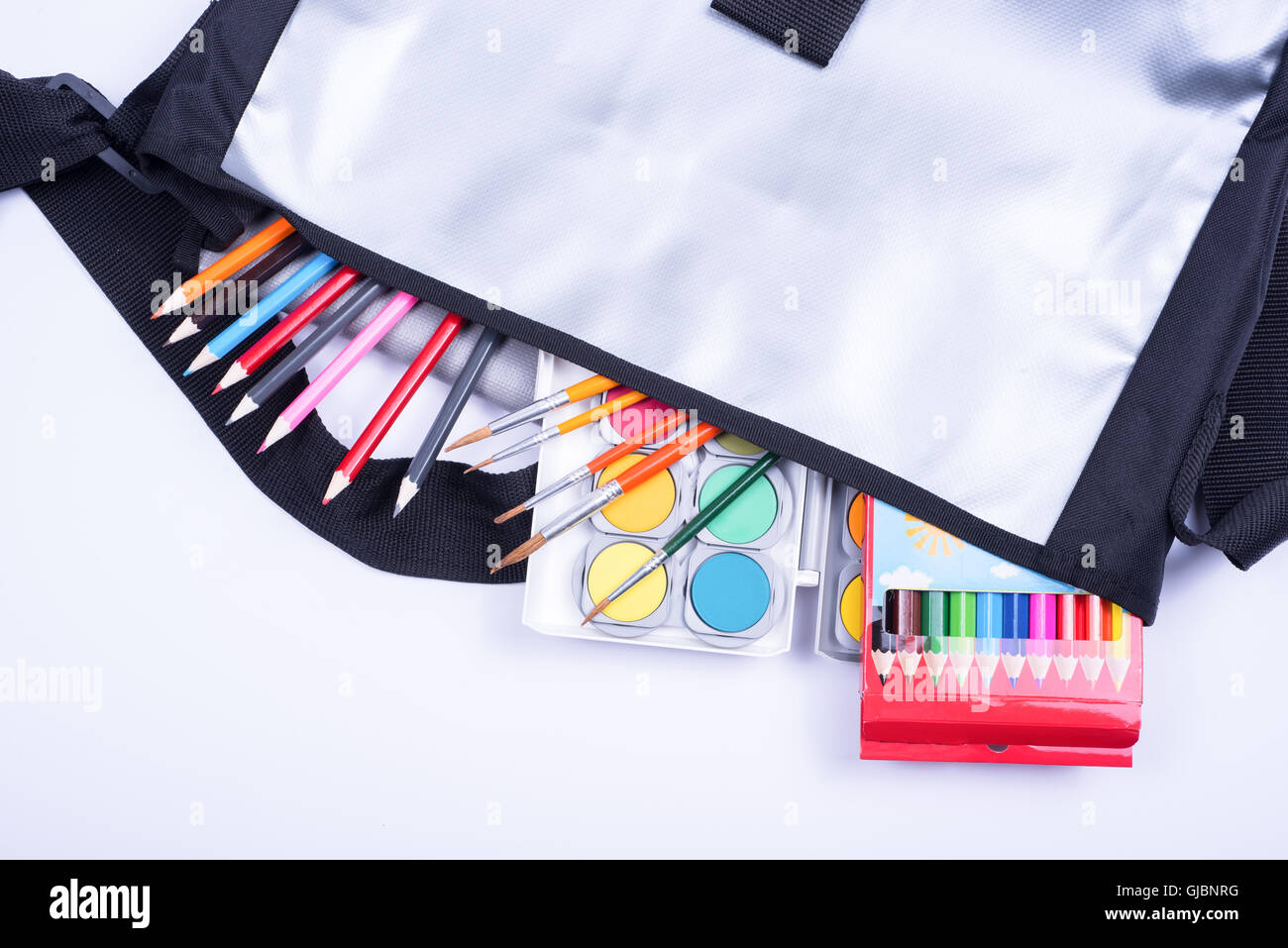 open bag with colorful items for the school start Stock Photo - Alamy
