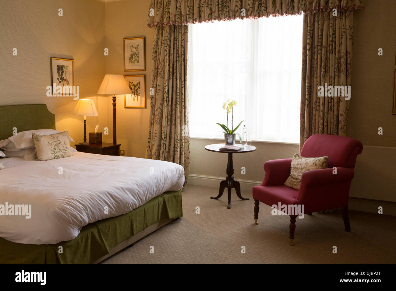 A chair and table in a bedroom at the Talbot Hotel in Malton, North ...