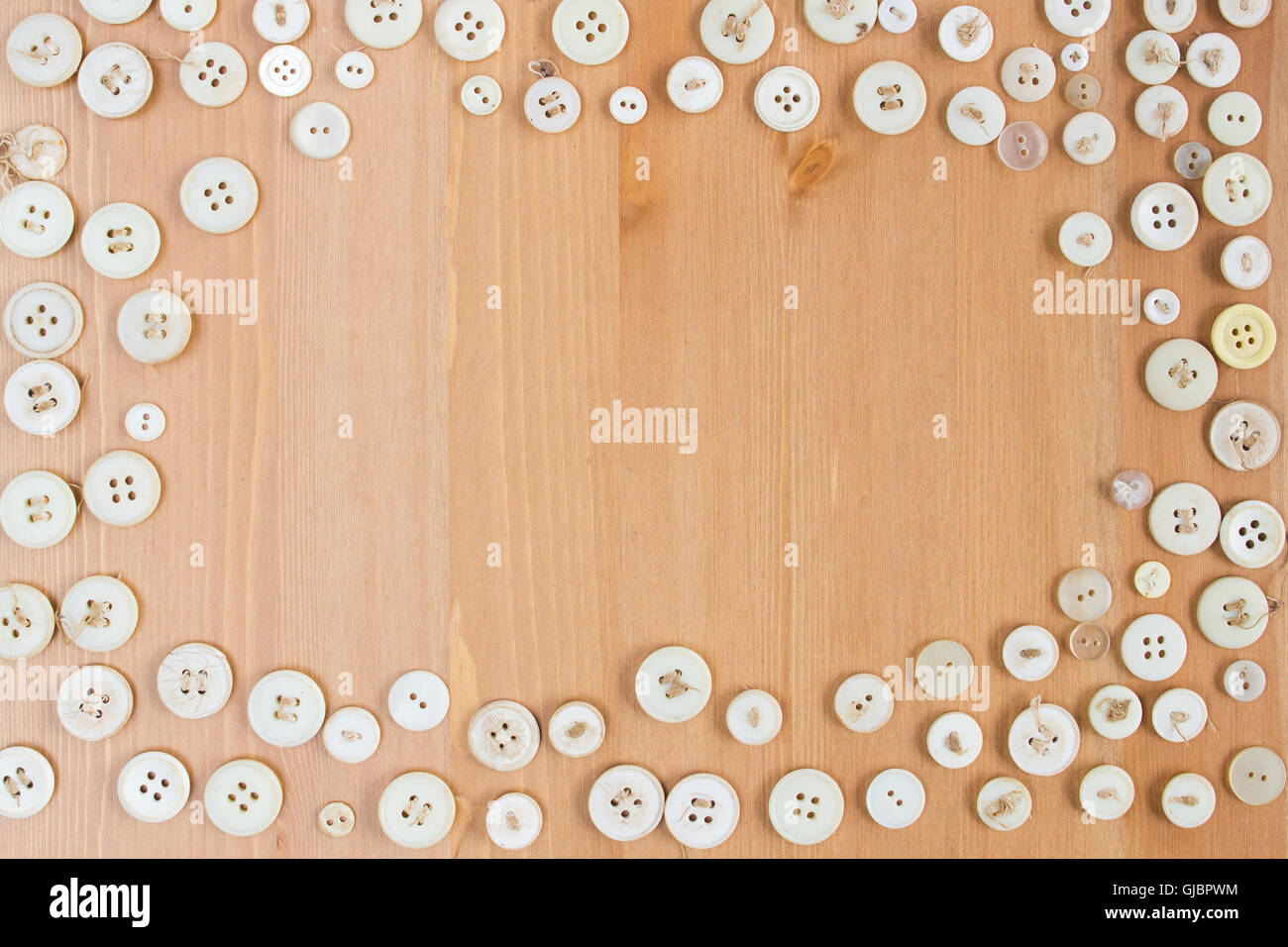 Frame border made of vintage buttons on wooden background Stock Photo ...