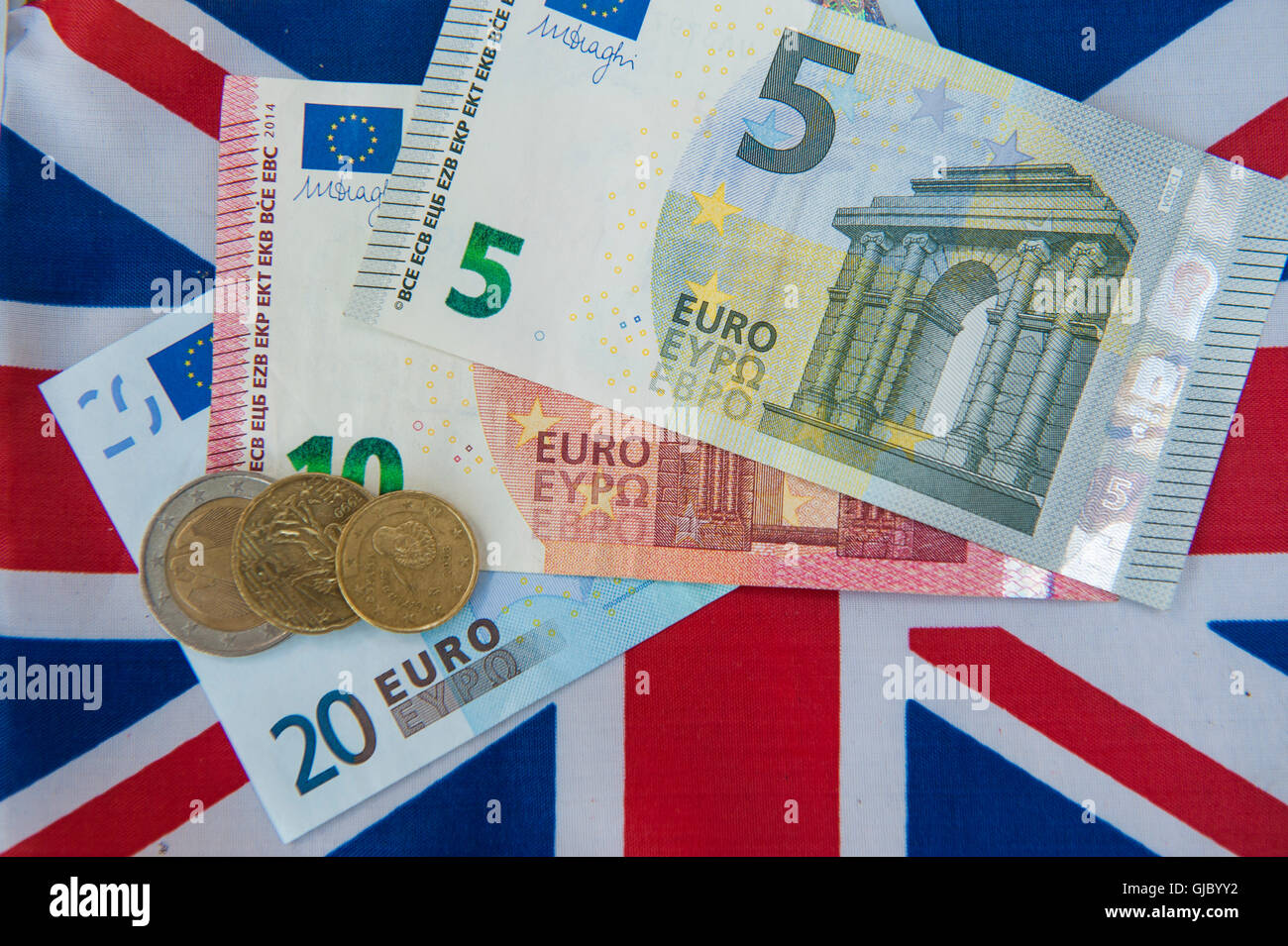 Euro coins on euro flag hi-res stock photography and images - Alamy