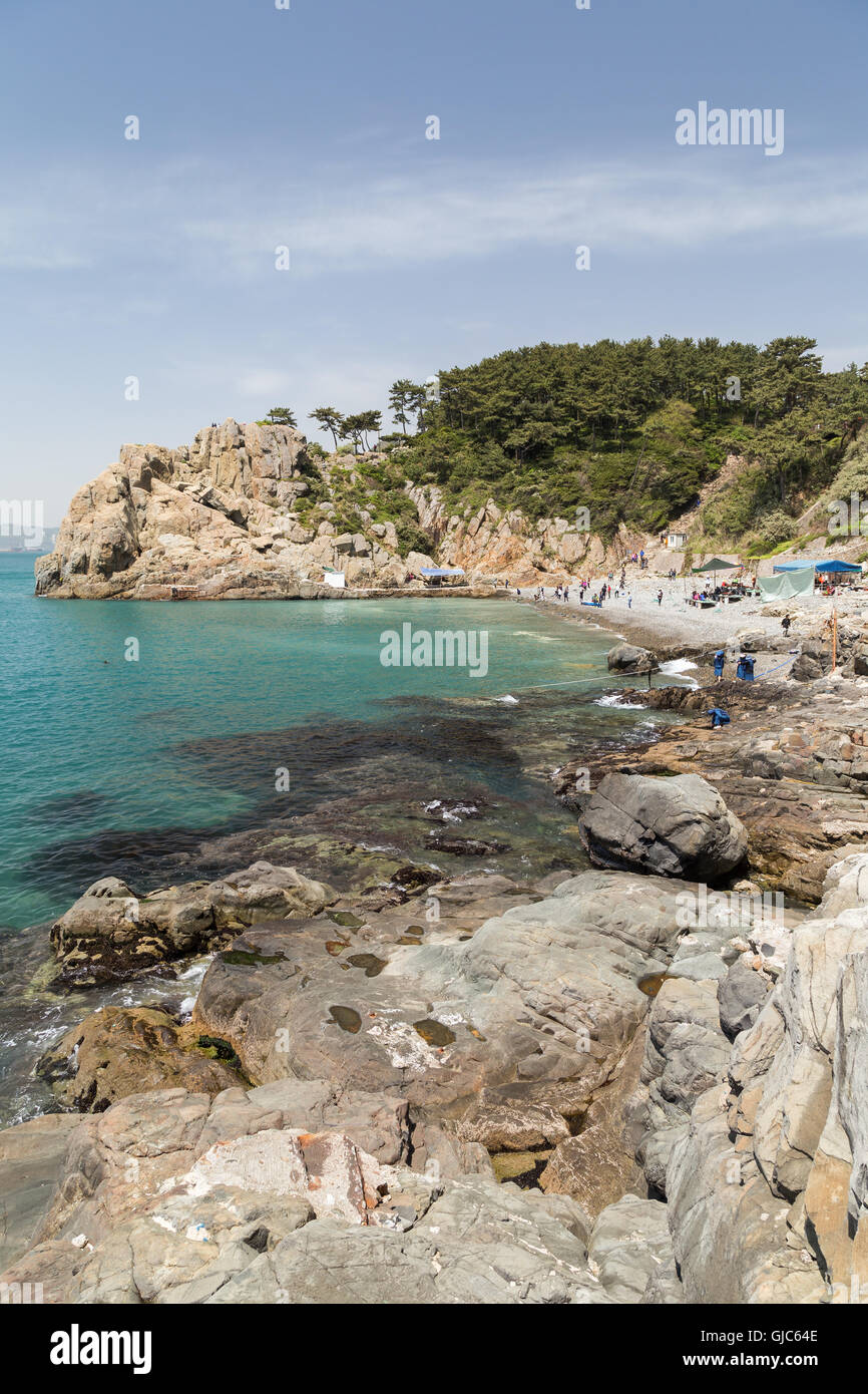 View of rocky coastline, cliff and pebble beach at the Taejongdae ...