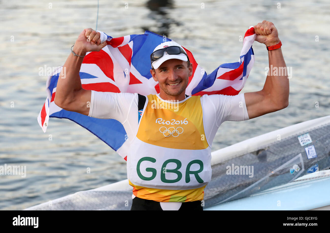 Great Britain's Giles Scott poses with a flag at the Maria da Gloria on ...