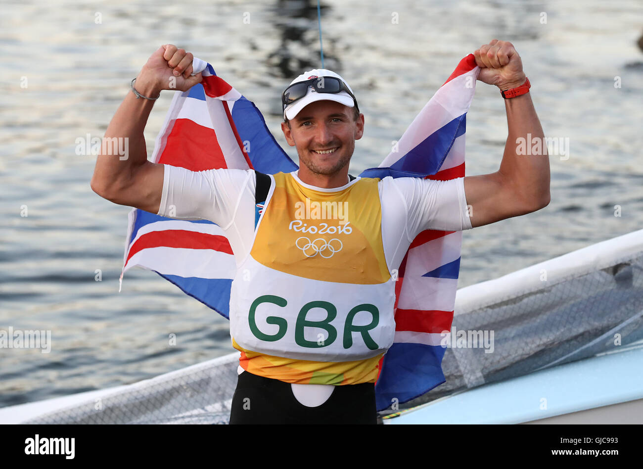Great Britain's Giles Scott poses with a flag at the Maria da Gloria on ...