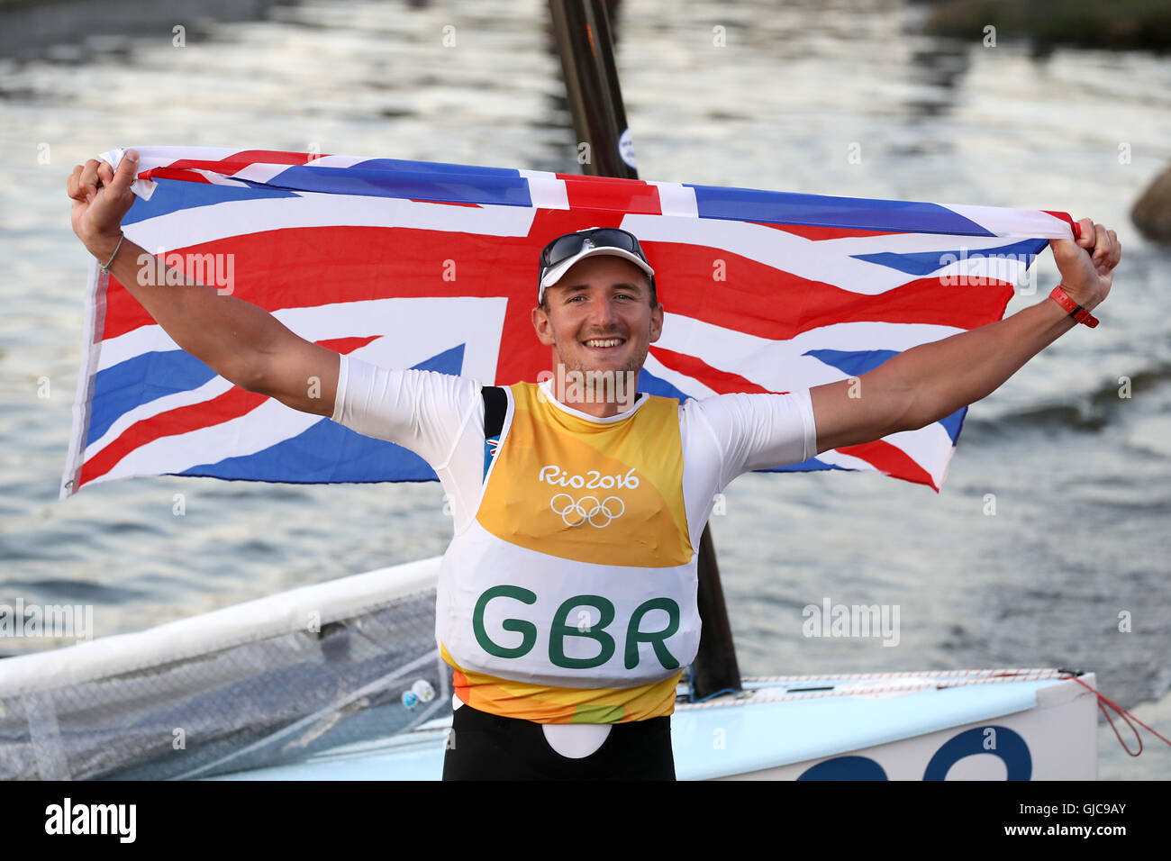 Great Britain's Giles Scott poses with a flag at the Maria da Gloria on ...