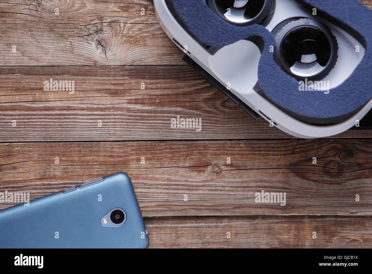 Modern smartphone with empty screen and virtual reality goggles Stock ...