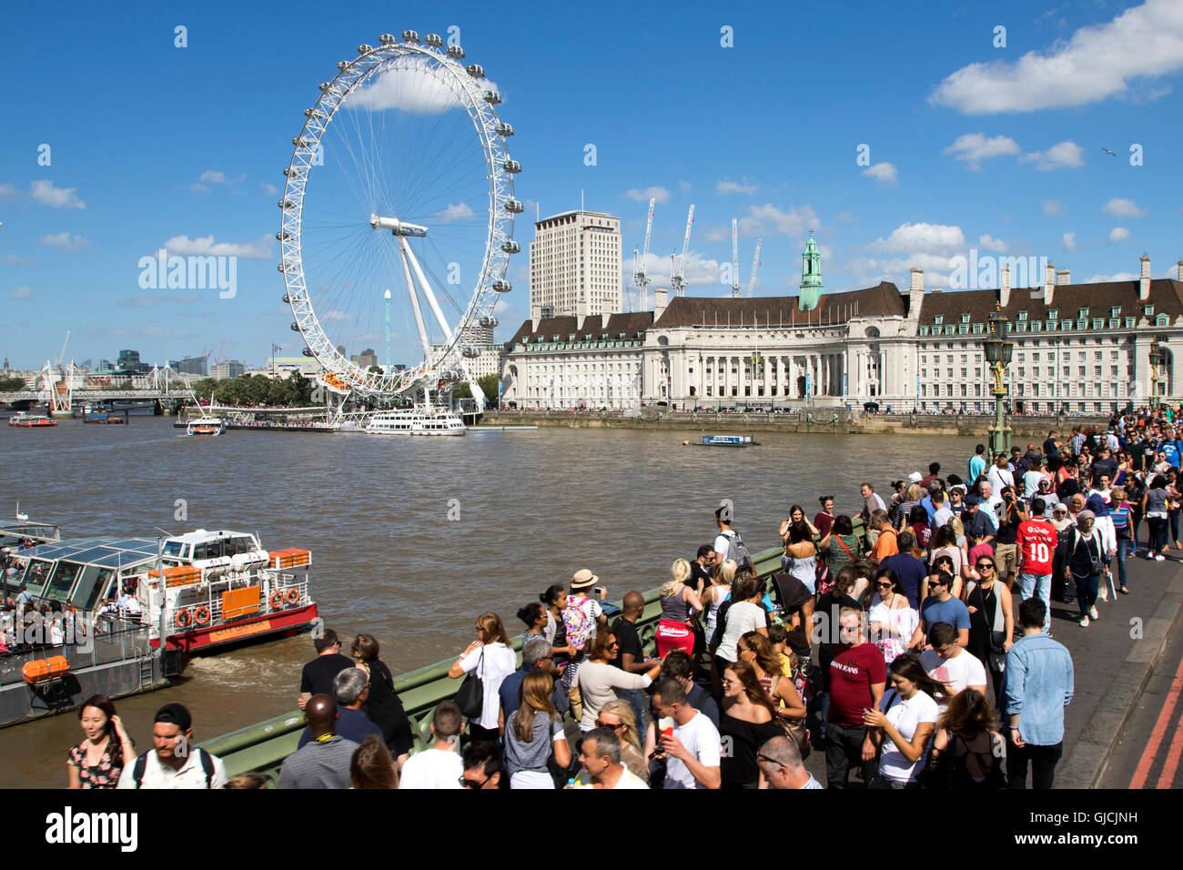 The London Eye giant Ferris wheel on the South Bank of the River Thames ...