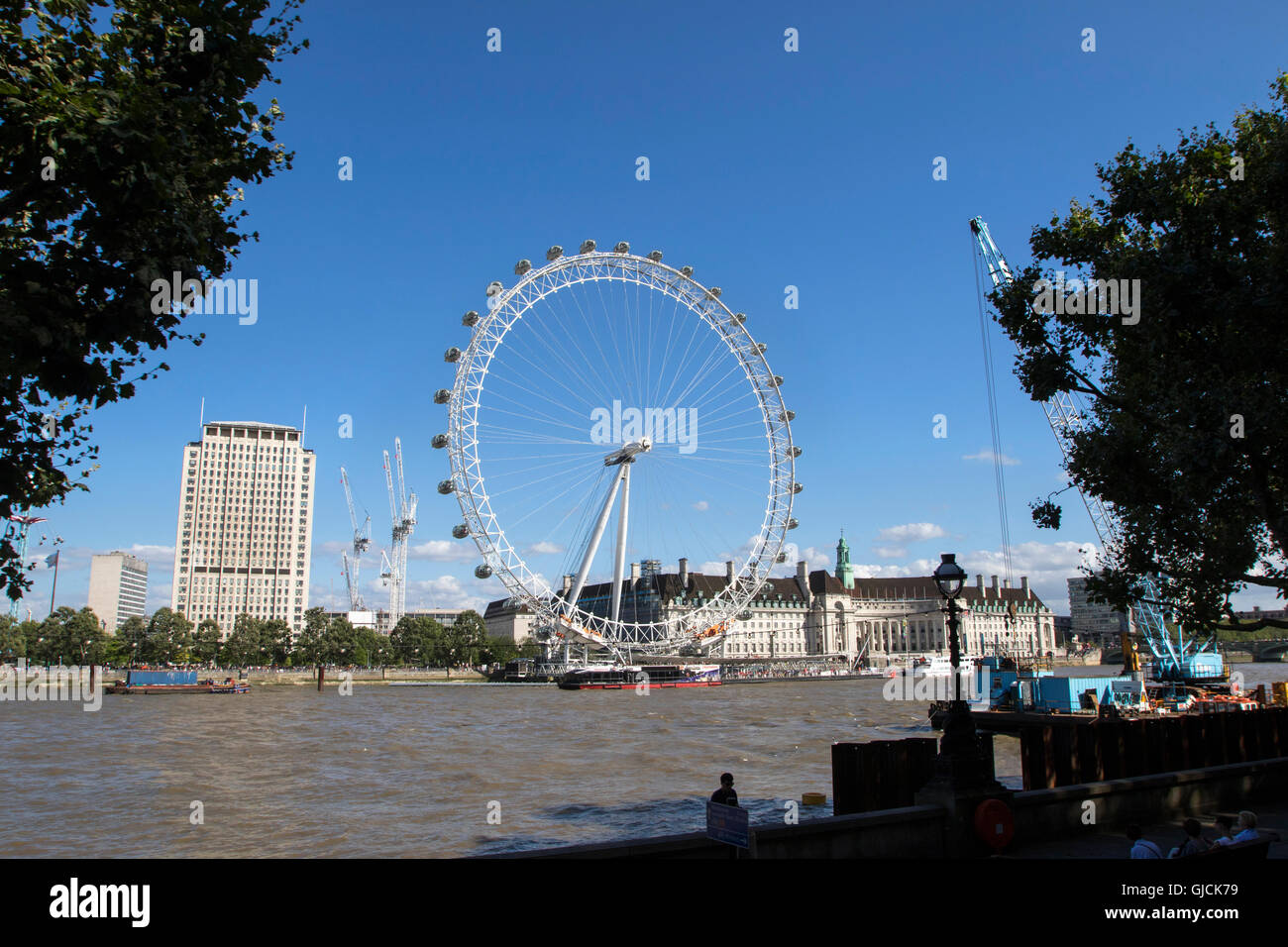 The London Eye giant Ferris wheel on the South Bank of the River Thames ...