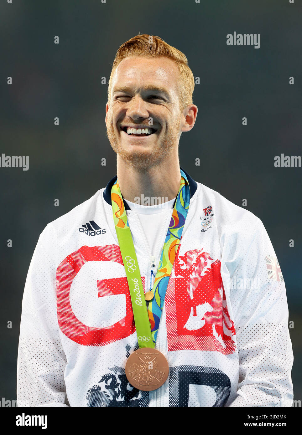Great Britain's Greg Rutherford reacts on the podium with his bronze ...