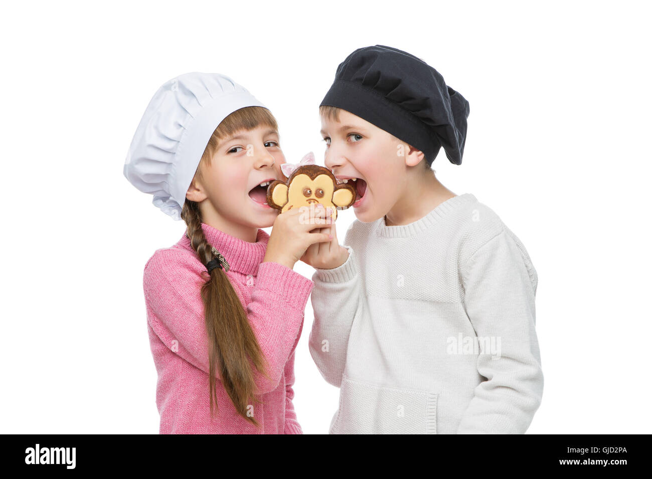Children with gingerbread christmas cookie Stock Photo - Alamy