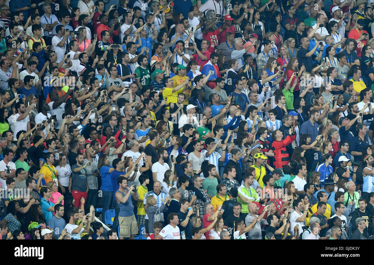 Rio de Janeiro, Brazil. 14th Aug, 2016. Spectators cheer in the stands ...