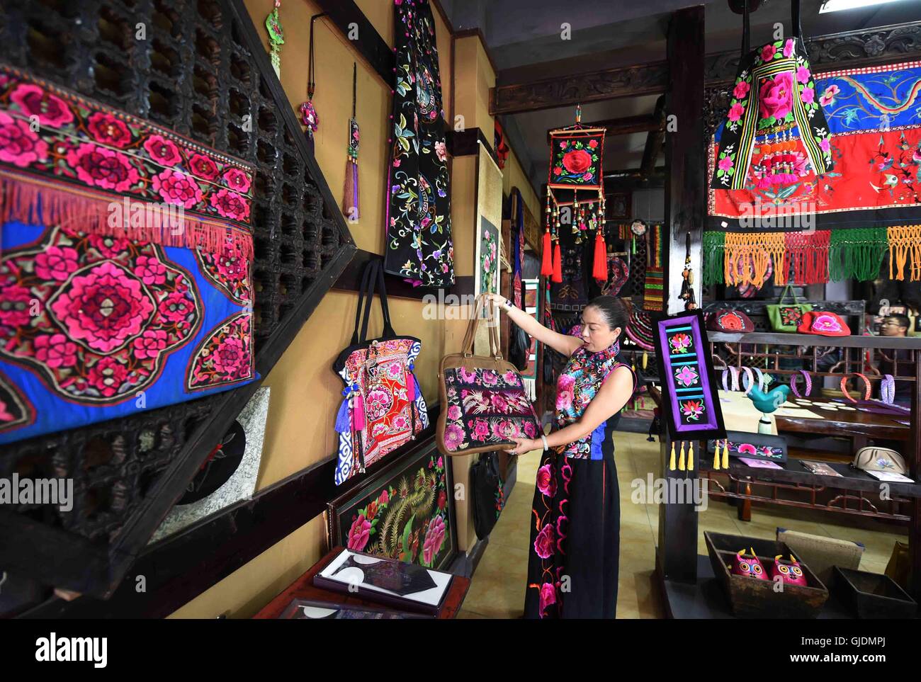 Dayao, China's Yunnan Province. 14th Aug, 2016. Luo Jun displays ...
