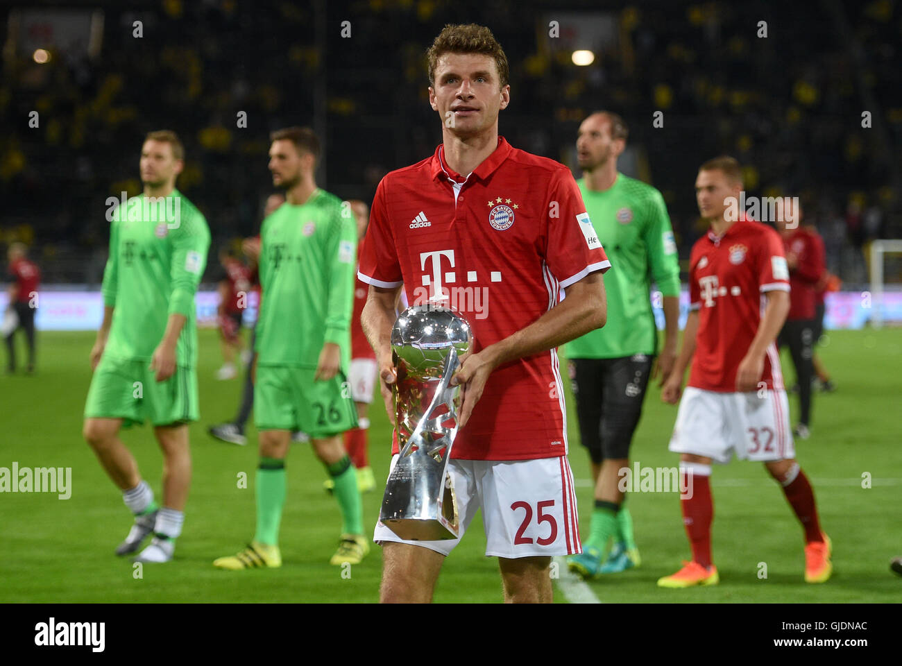 Dortmund, Germany. 14th Aug, 2016. Munich's Thomas Mueller holding the ...