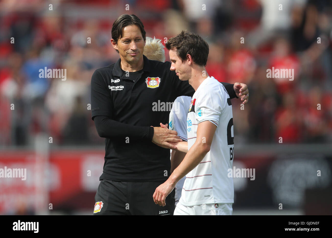 Leverkusen, Germany. 13th Aug, 2016. Leverkusen's Robbie Kruse (r) and ...