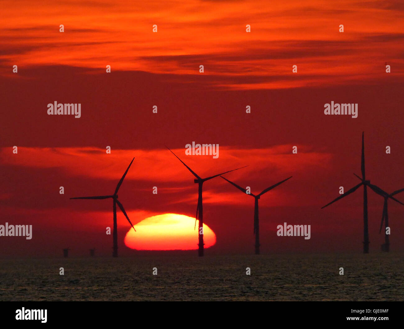 Wind turbines sunset merseyside hi-res stock photography and images - Alamy
