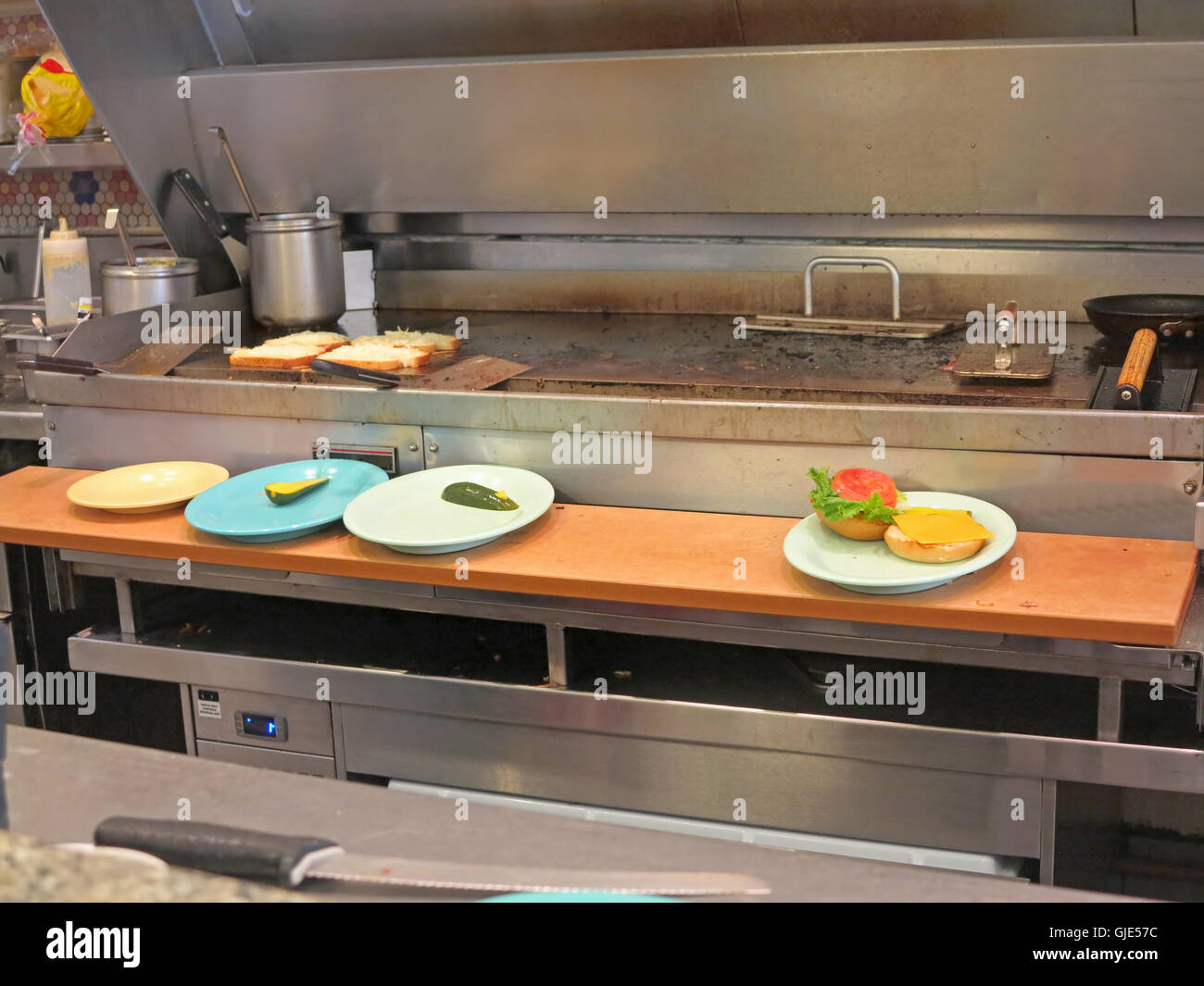 A commercial kitchen including a large grill Stock Photo - Alamy