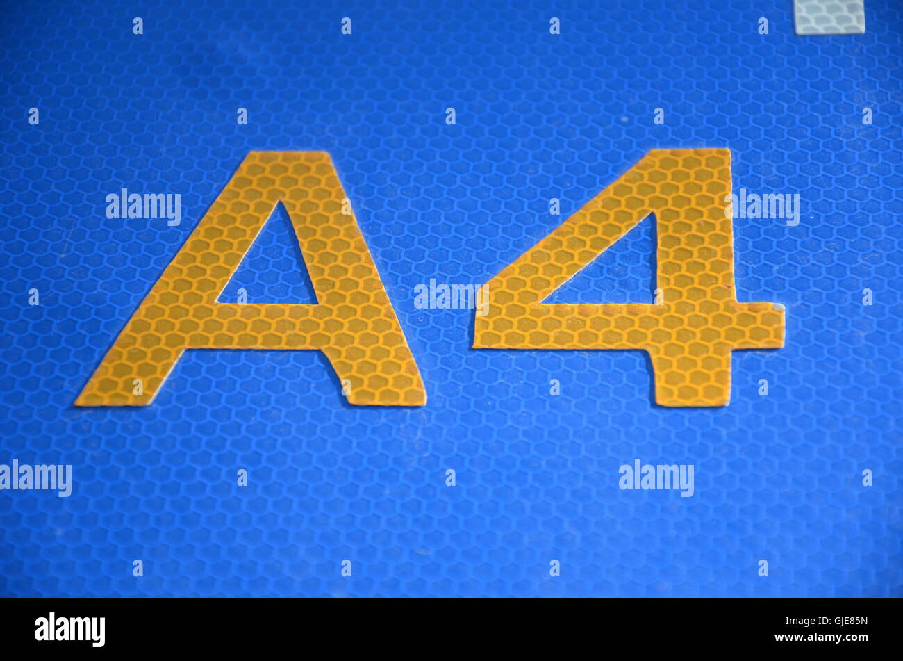 A 4 character on blue background Stock Photo - Alamy