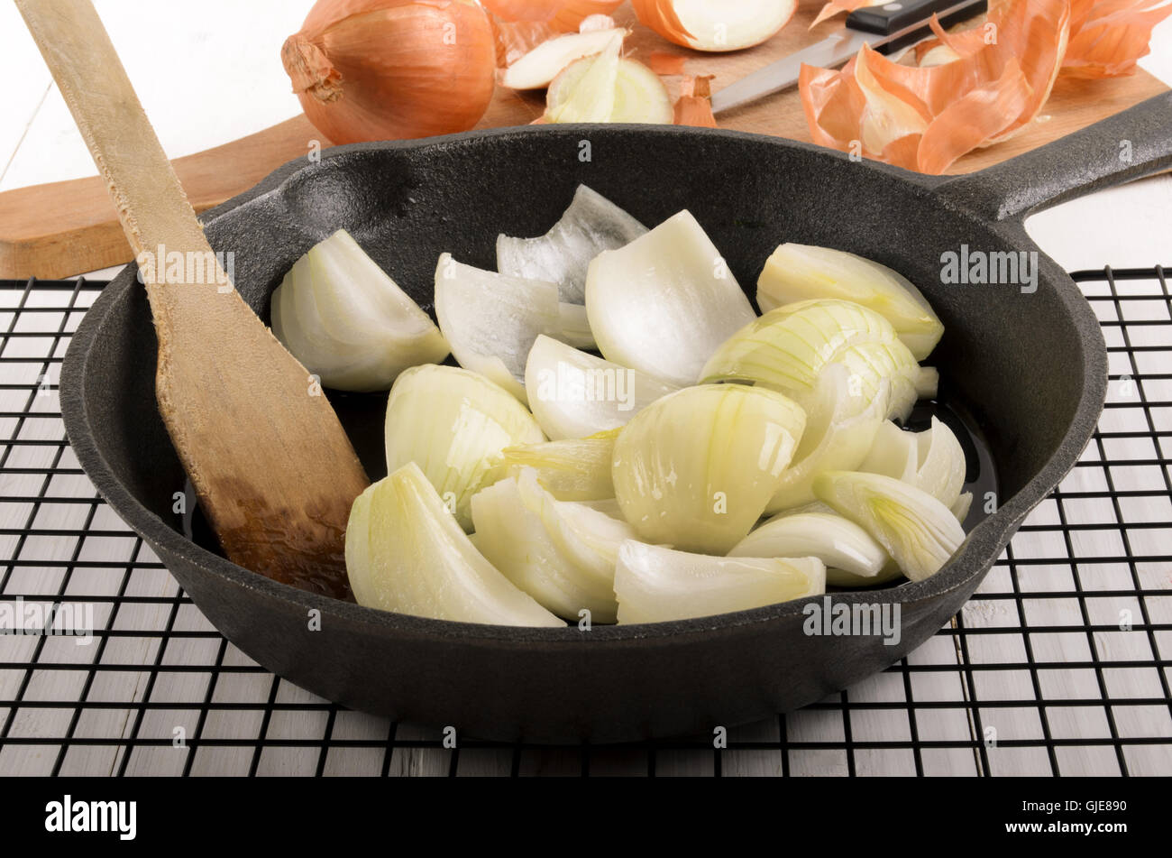 onion chunks with sunflower oil in a cast iron pan on cooling rack ...