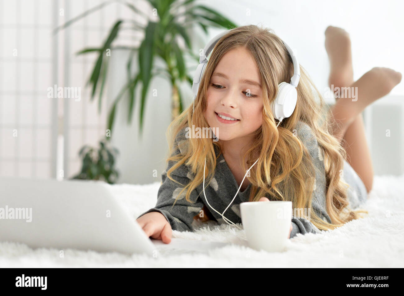 Little girl using computer Stock Photo - Alamy