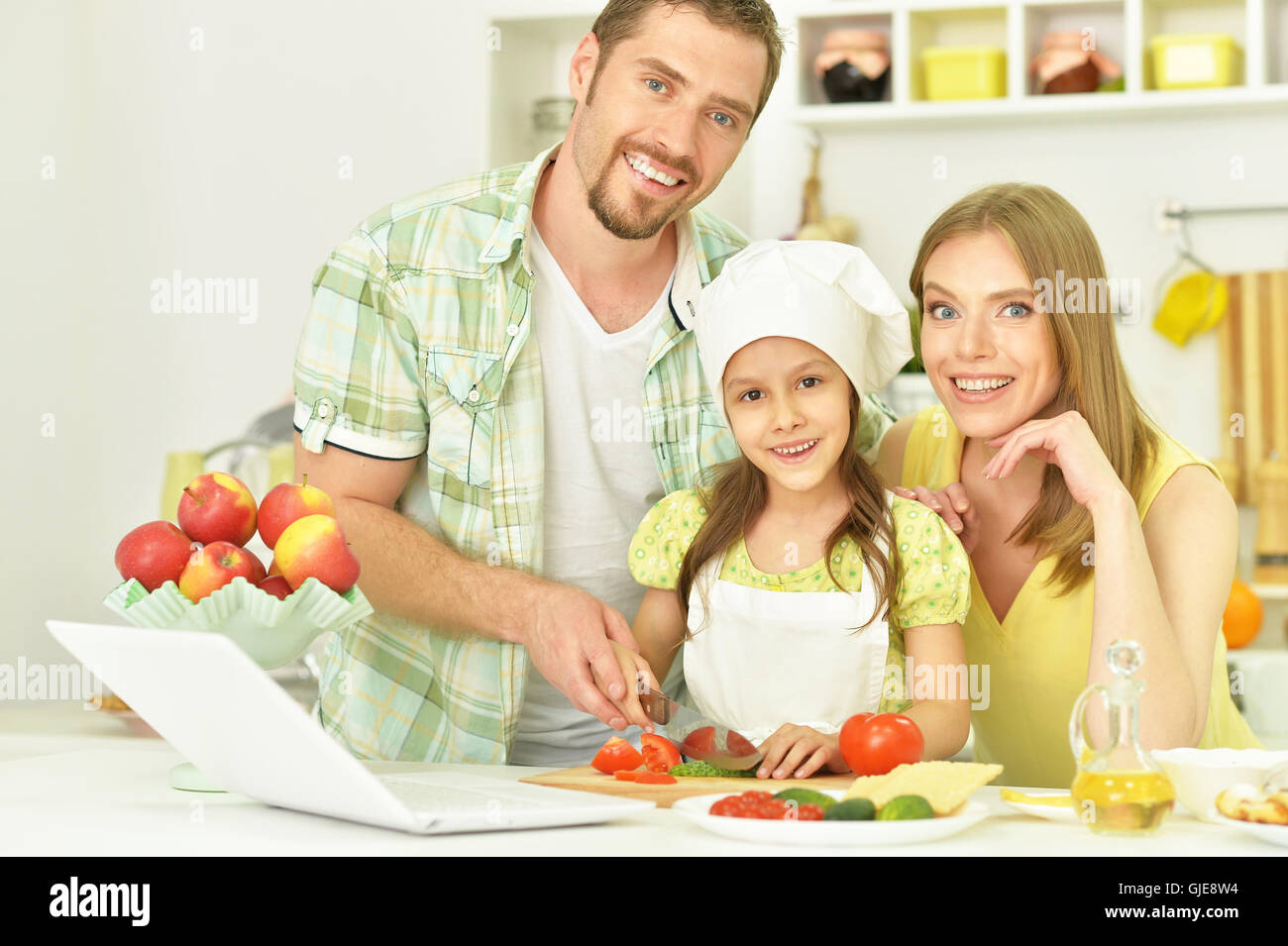 happy family cooking in kitchen Stock Photo - Alamy