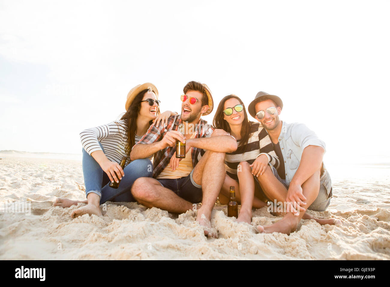 Friends at the beach enjoying the summer Stock Photo - Alamy