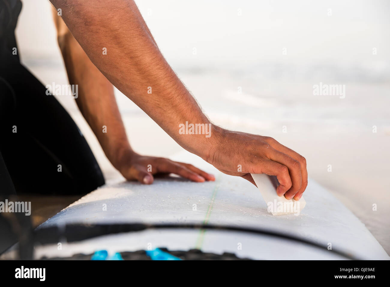 A surfer getting ready for the surf Stock Photo - Alamy