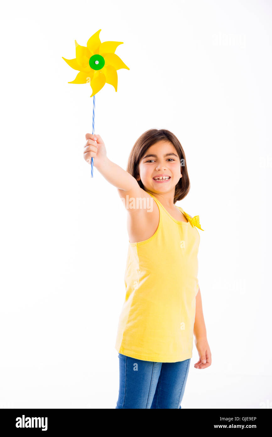 Little girl playing with a toy windmill Stock Photo - Alamy